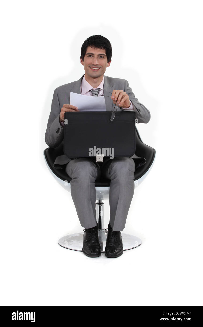 Man taking papers out his briefcase Stock Photo - Alamy