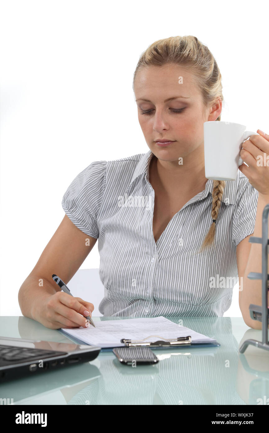 Secretary filling in paperwork hi-res stock photography and images - Alamy