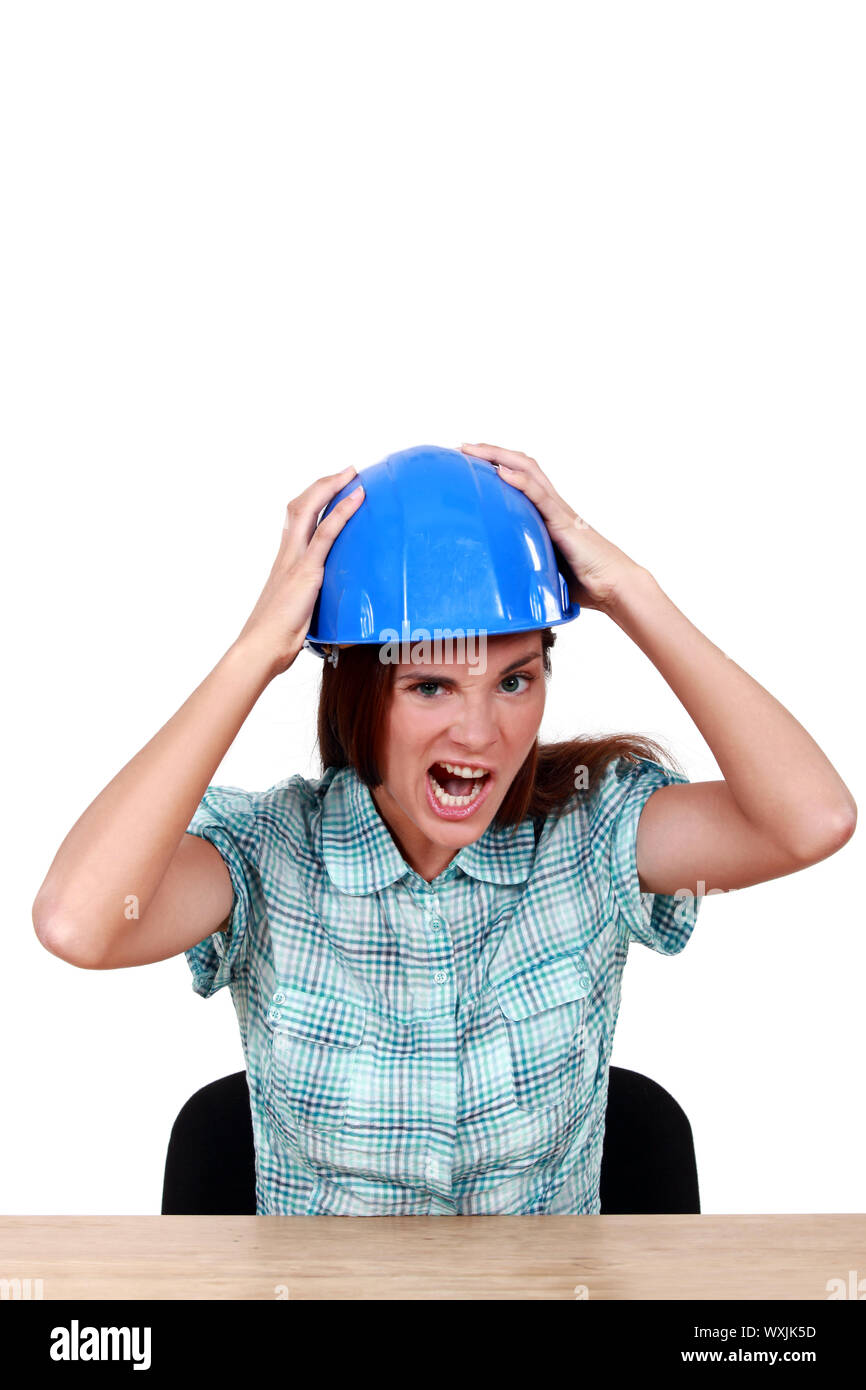 A scowling female construction worker Stock Photo - Alamy