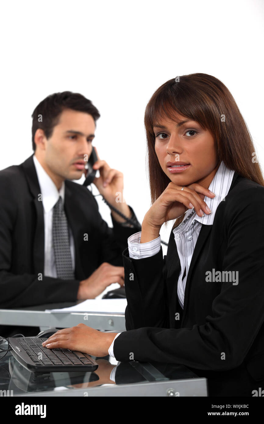 Two business colleagues working side by side Stock Photo - Alamy