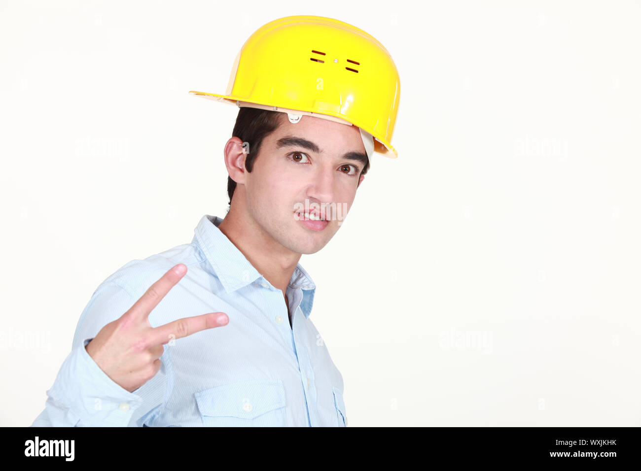 man doing peace sign with his fingers Stock Photo - Alamy