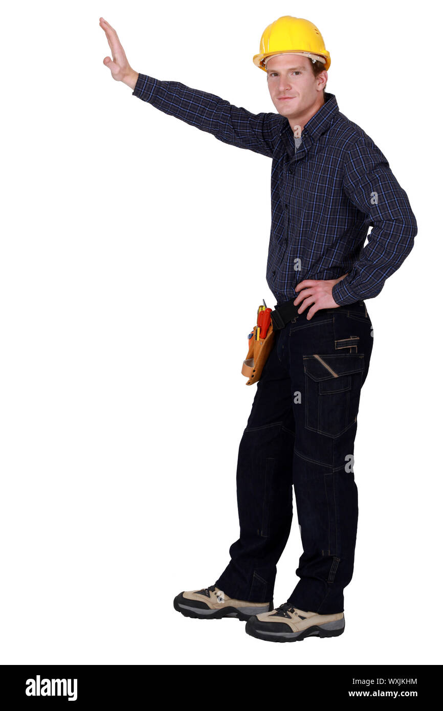 Construction worker holding out hand Stock Photo - Alamy