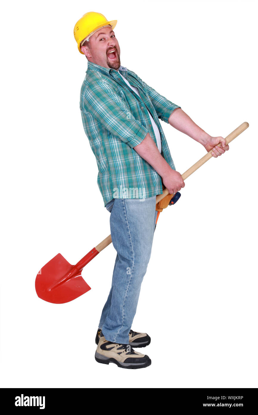 Construction worker riding a shovel Stock Photo - Alamy