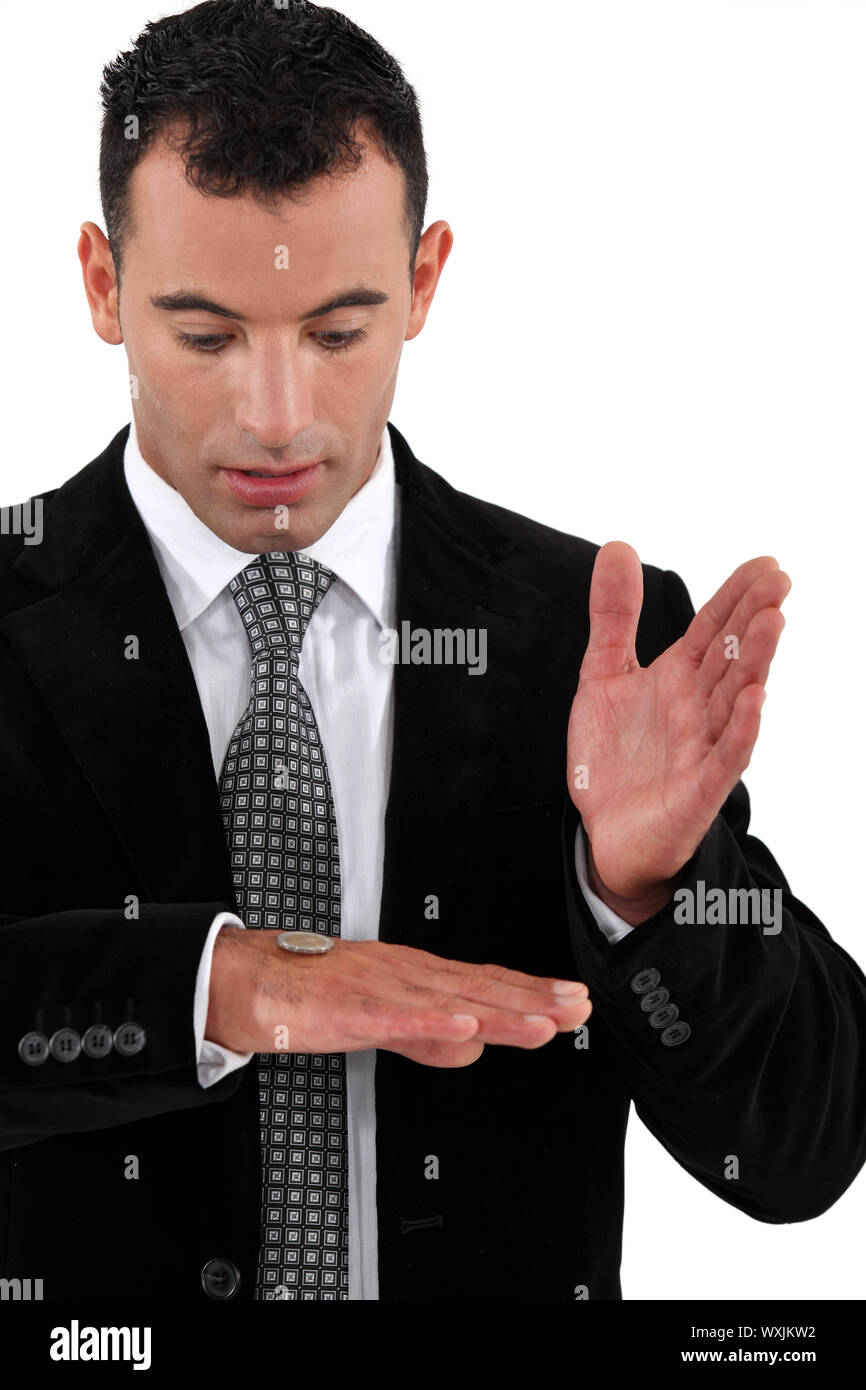 man flipping a coin Stock Photo - Alamy