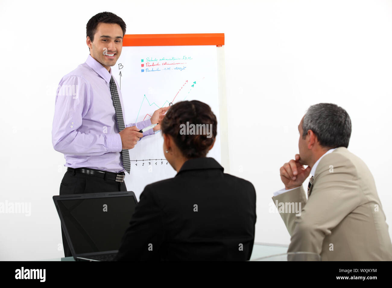 Man stood giving a presentation Stock Photo - Alamy