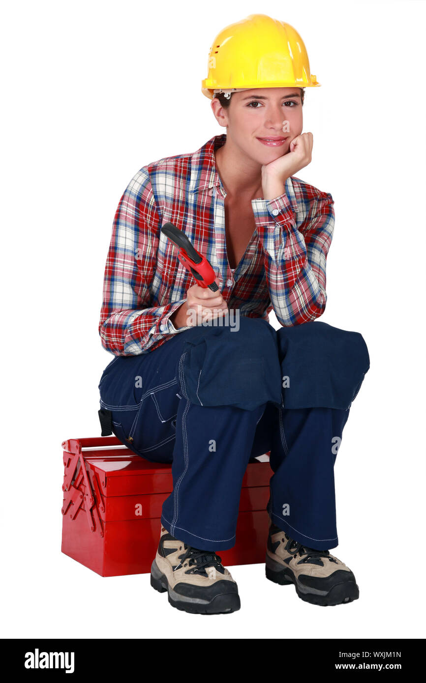 A female worker sitting on her toolbox Stock Photo - Alamy