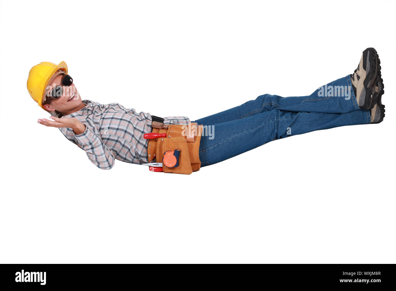 Female construction worker taking it easy Stock Photo - Alamy