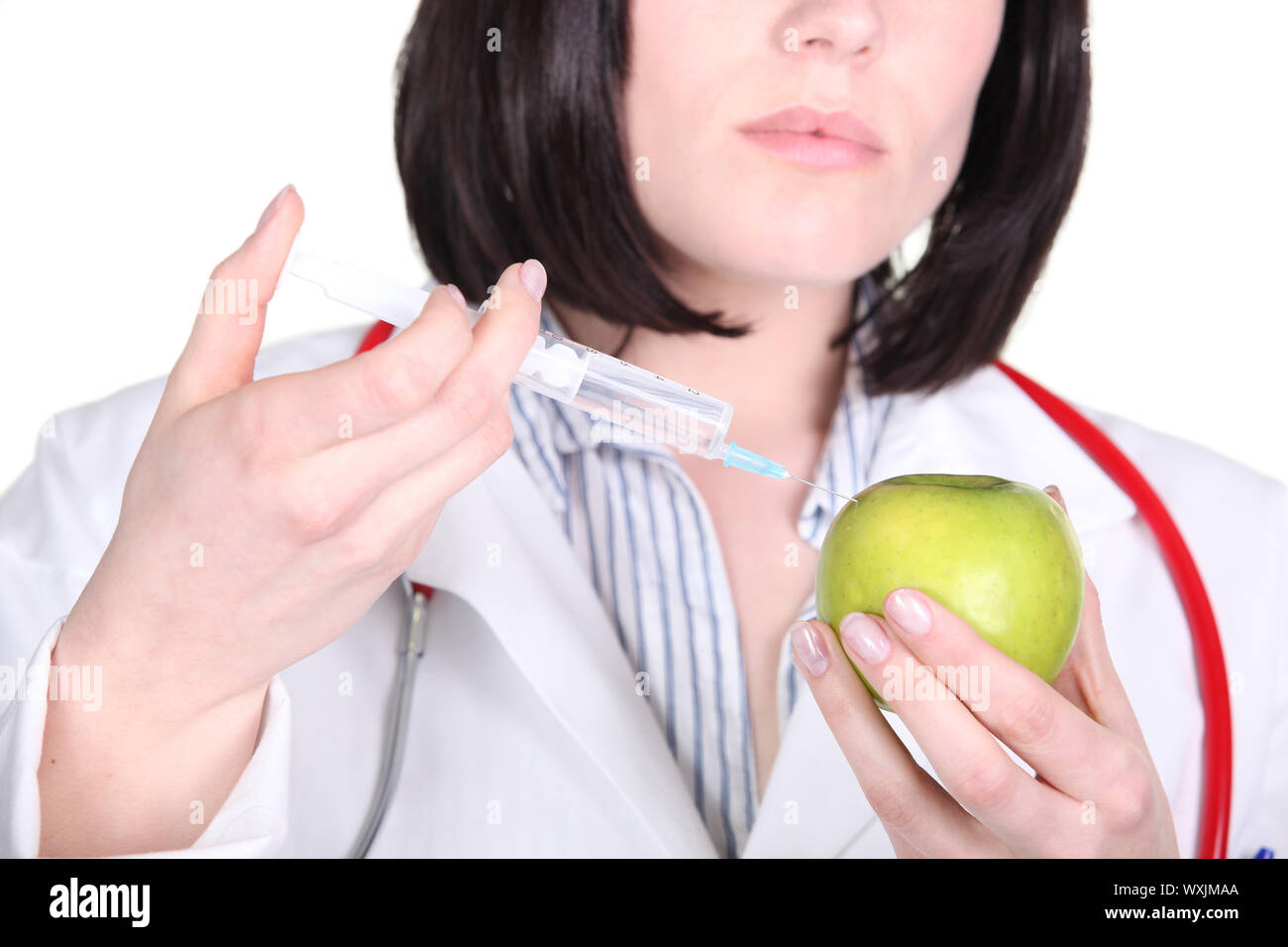 Doctor injecting drugs apple hi-res stock photography and images - Alamy