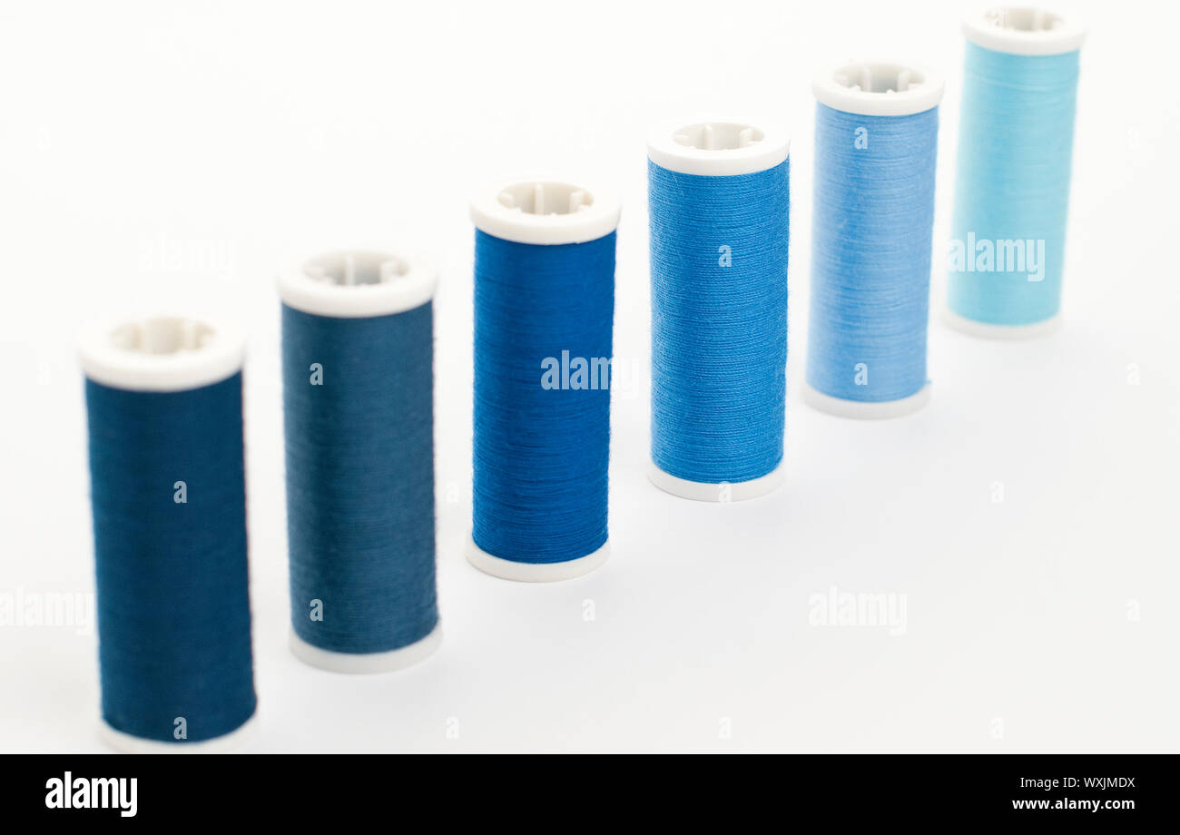 Colorful Spools of sewing thread isolated on white background Stock ...