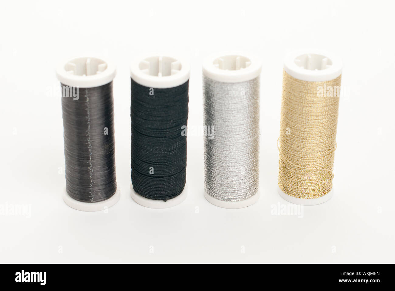 Colorful Spools of sewing thread isolated on white background Stock ...
