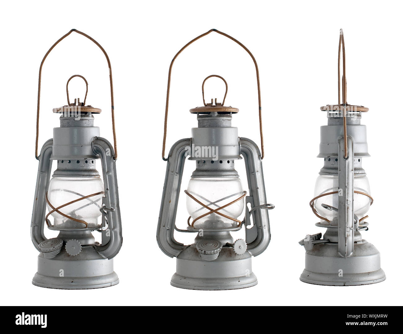 Old oil lamp isolated of the background and in diferent views Stock ...