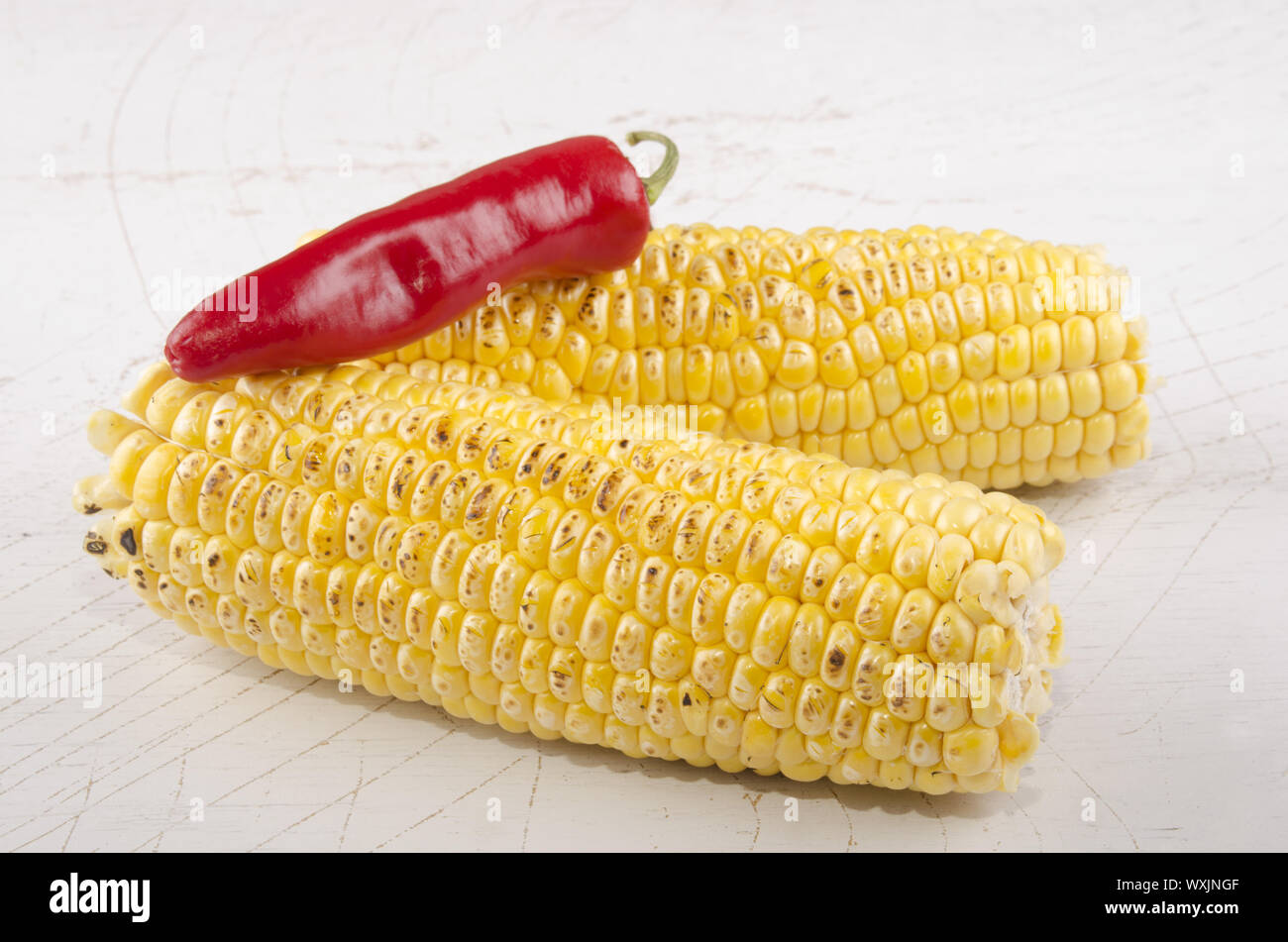 grilled corn on the cob and red chili Stock Photo - Alamy