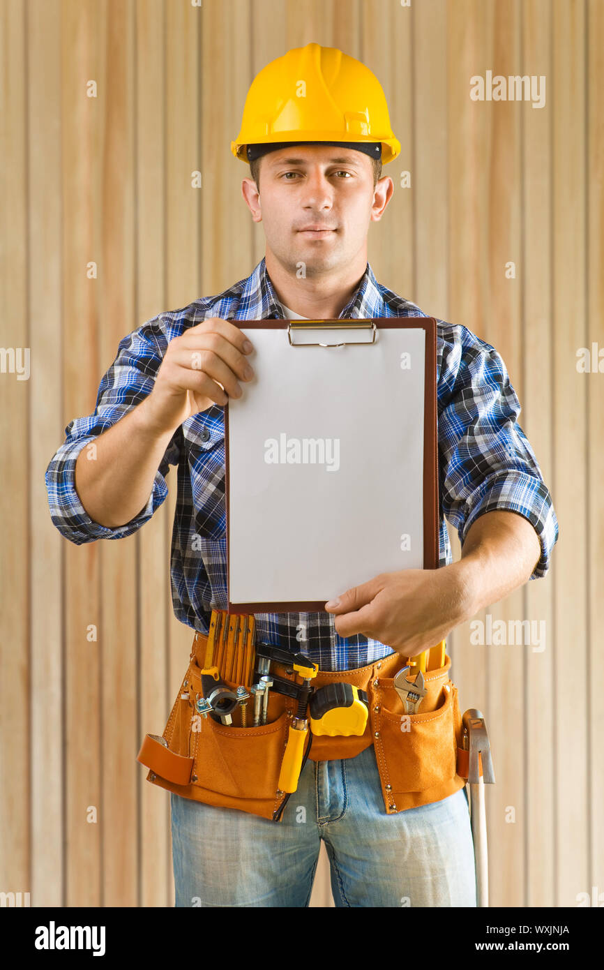 worker holding paperclip Stock Photo - Alamy