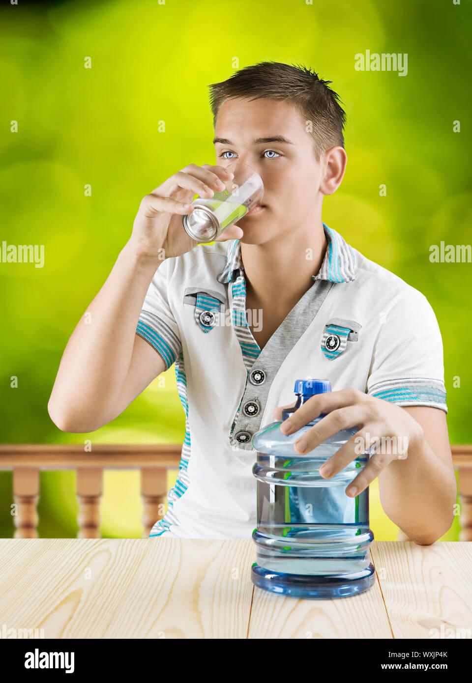 a guy drinking water from glass Stock Photo - Alamy
