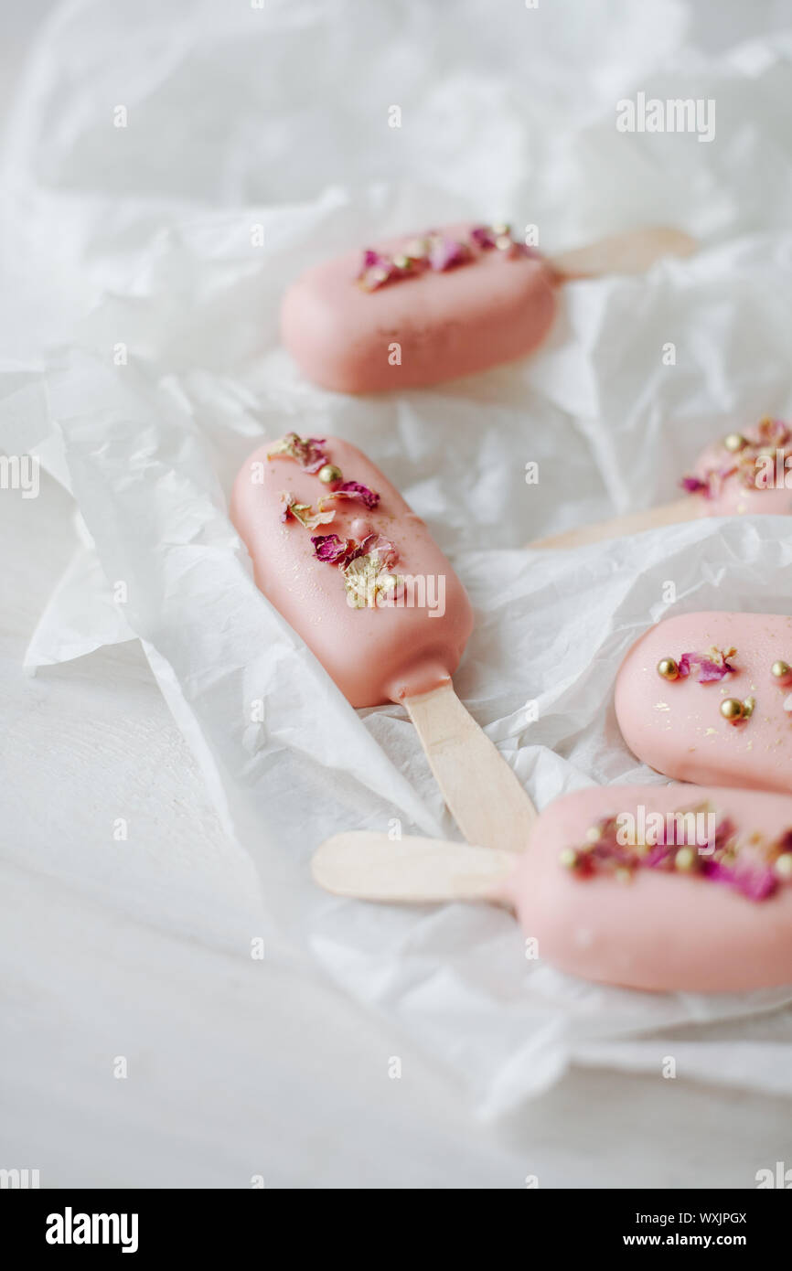 Stack of ice-cream cake pops on parchment Stock Photo - Alamy