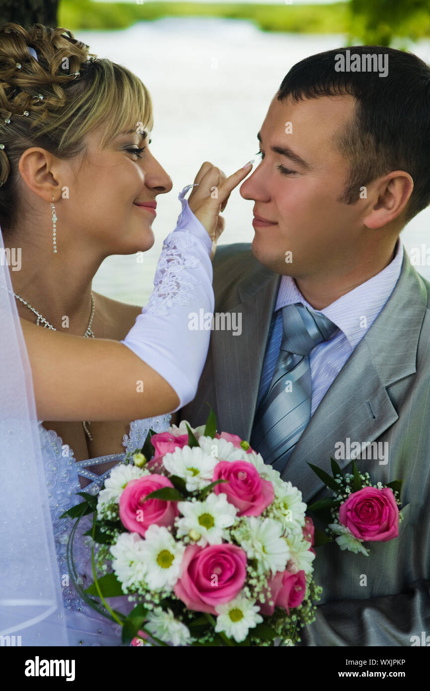 The bride looks after the groom Stock Photo - Alamy