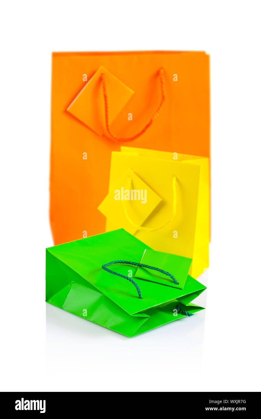 three colored paper bags isolated Stock Photo - Alamy