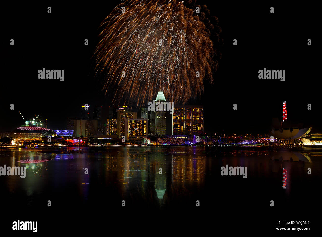 Fireworks over Marina bay in Singapore on National day Stock Photo - Alamy