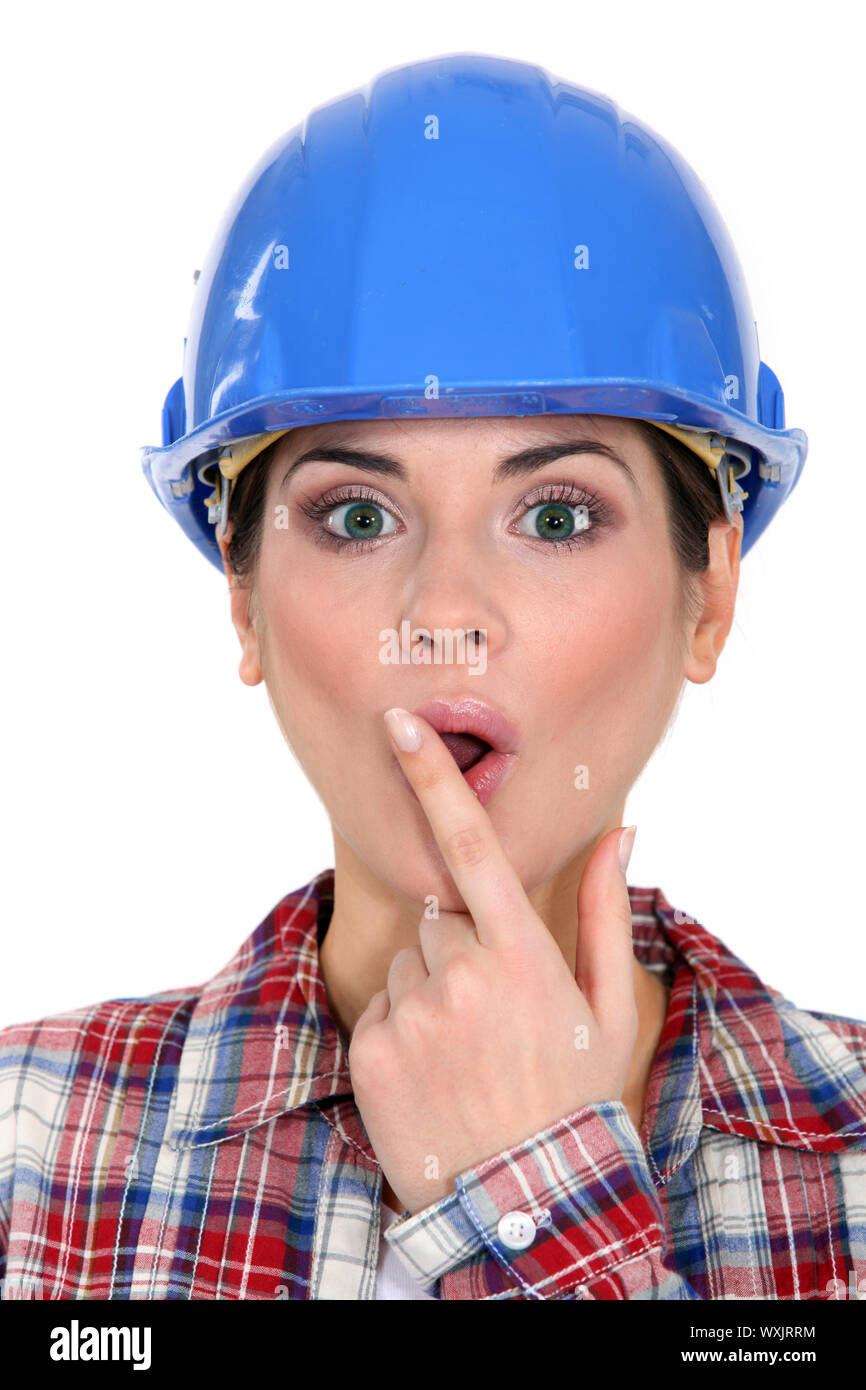 Shocked female builder Stock Photo - Alamy