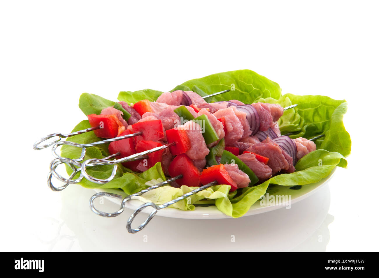 Pig meat pins with vegetables for roasting on the barbecue Stock Photo ...