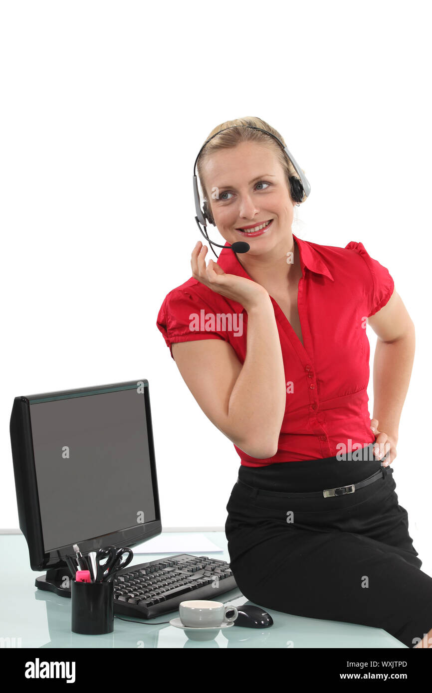Secretary wearing a headset Stock Photo - Alamy