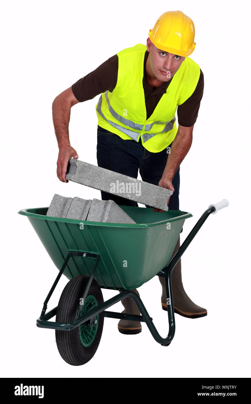 Man carrying heavy brick hi-res stock photography and images - Alamy