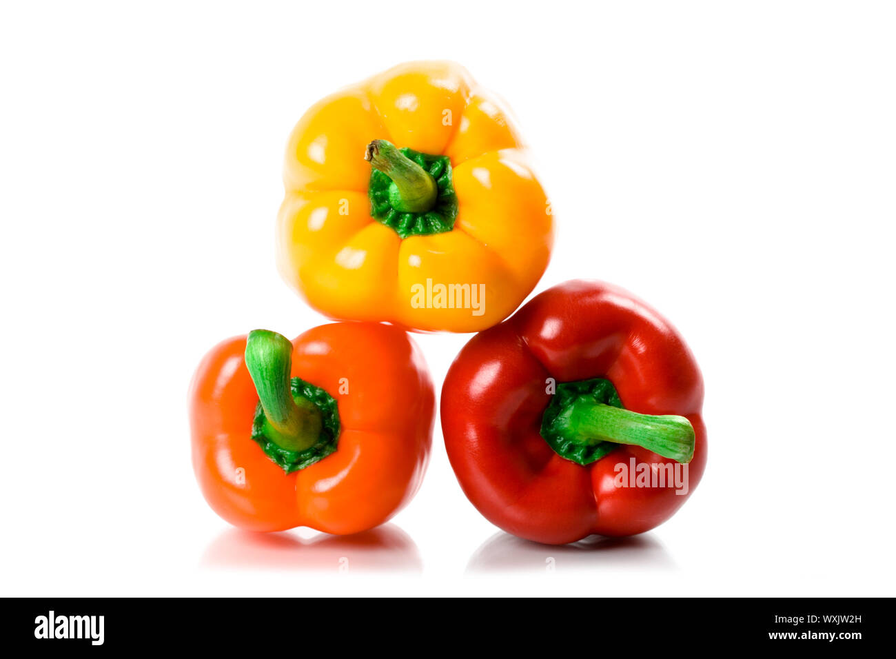 three bell peppers isolated on white background Stock Photo - Alamy