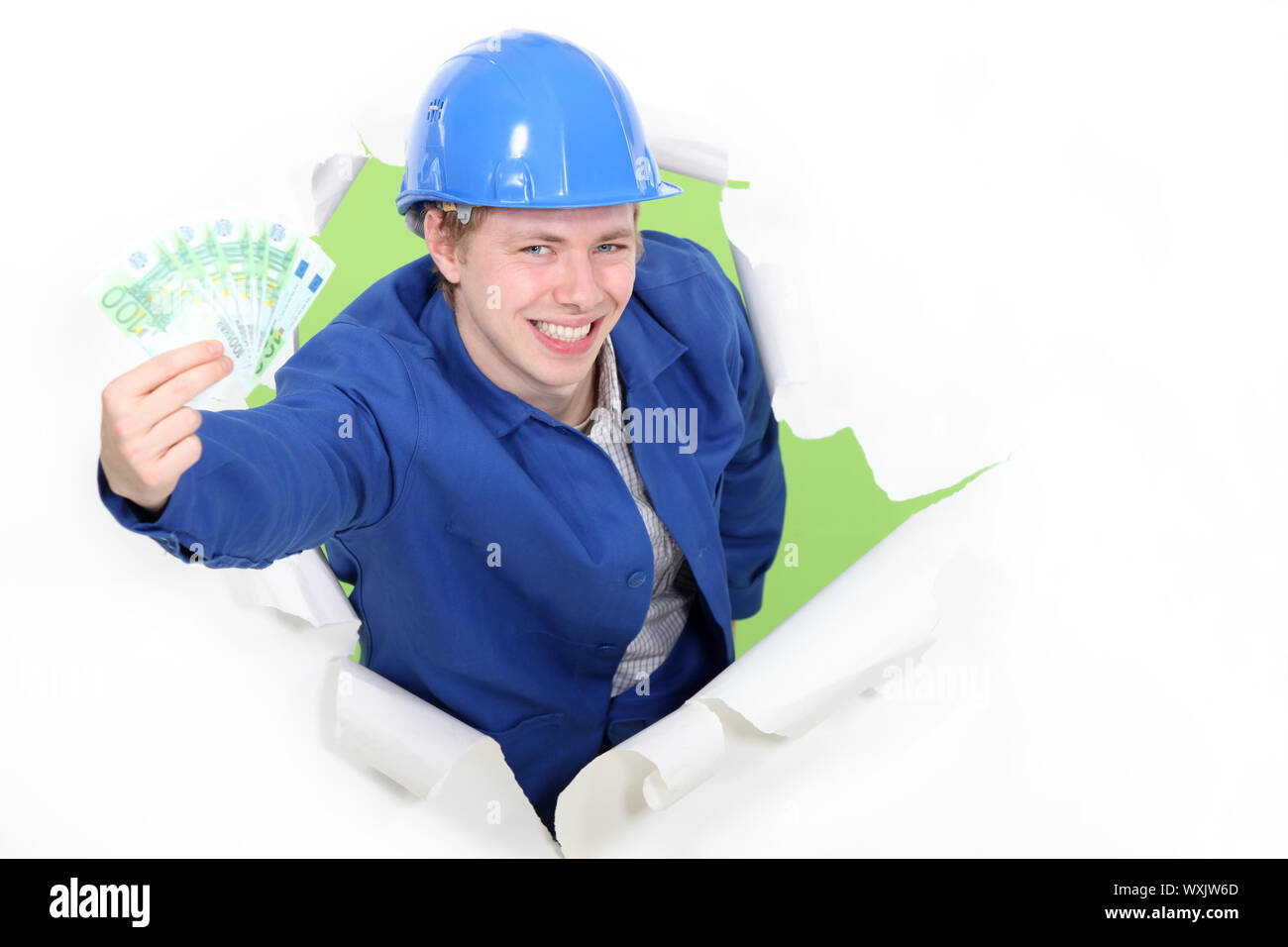 Worker showing cash Stock Photo - Alamy
