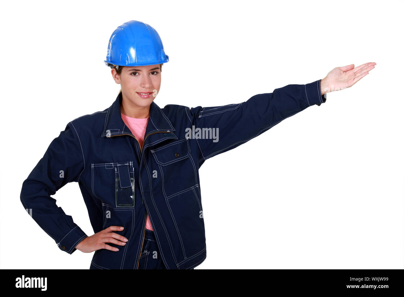A female manual worker presenting something Stock Photo - Alamy