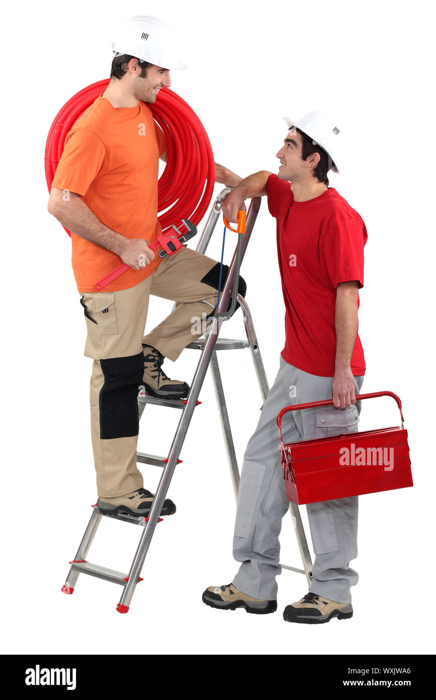 Two electricians working together Stock Photo - Alamy