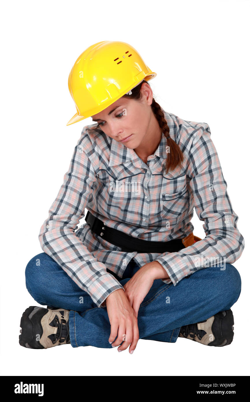 Sad female builder Stock Photo - Alamy