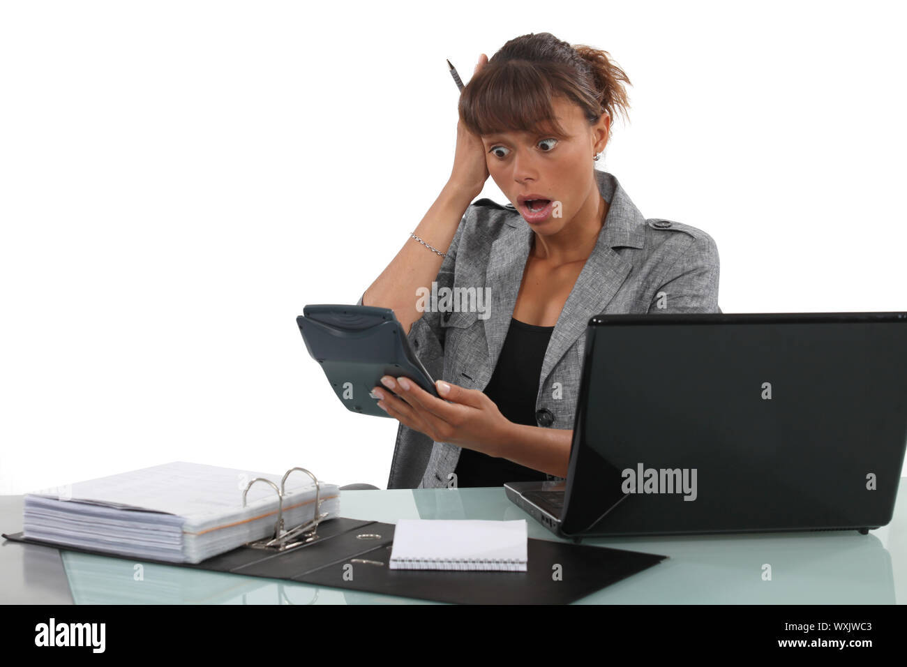 Woman shocked by financial results Stock Photo - Alamy