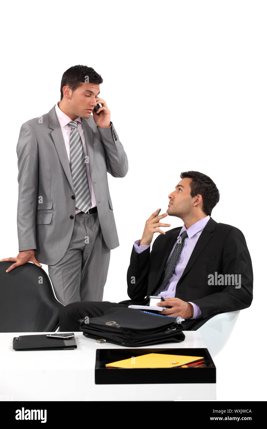 Businessmen patiently waiting Stock Photo - Alamy