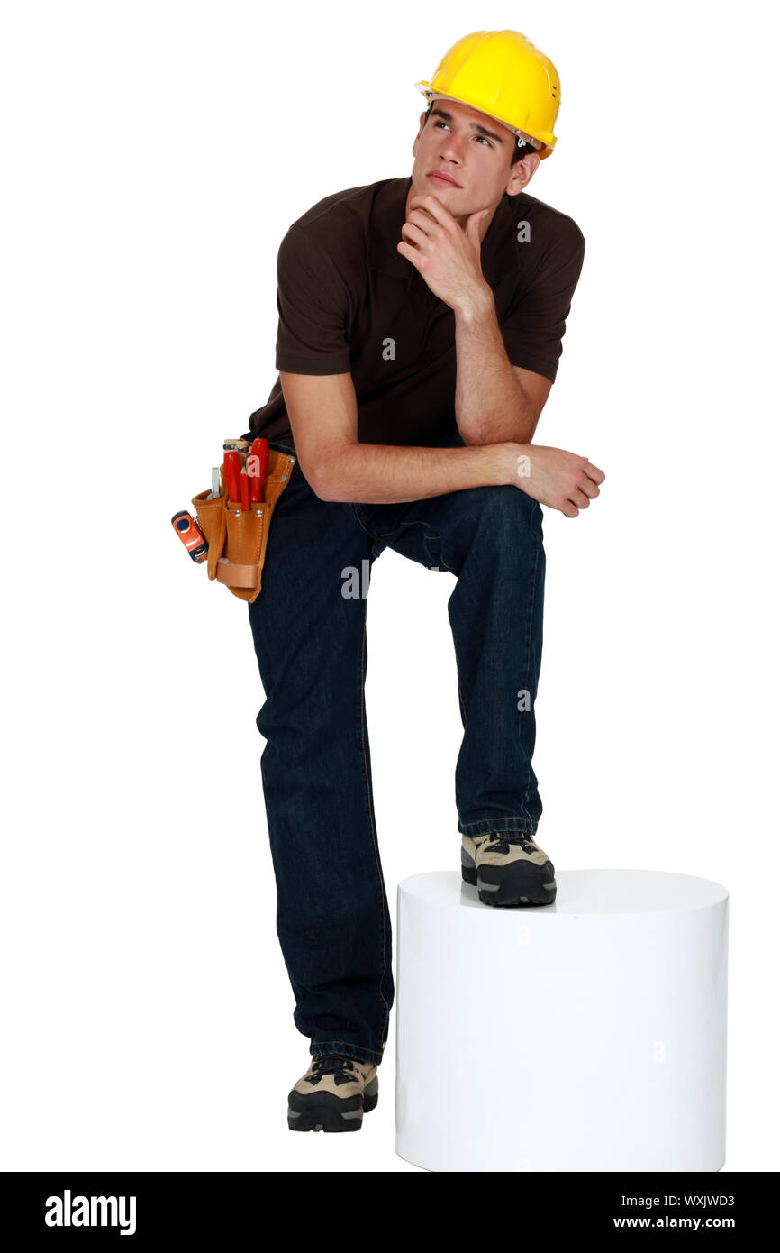 young craftsman thinking Stock Photo - Alamy