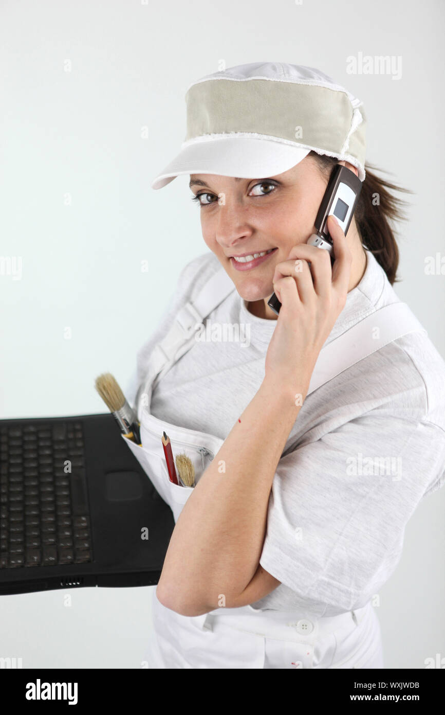 female painter making a call Stock Photo - Alamy