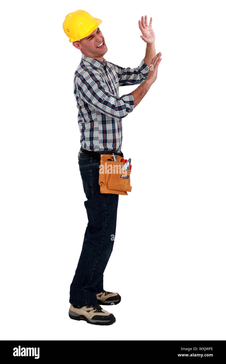 irritated craftsman making a stop sign with his hands Stock Photo - Alamy