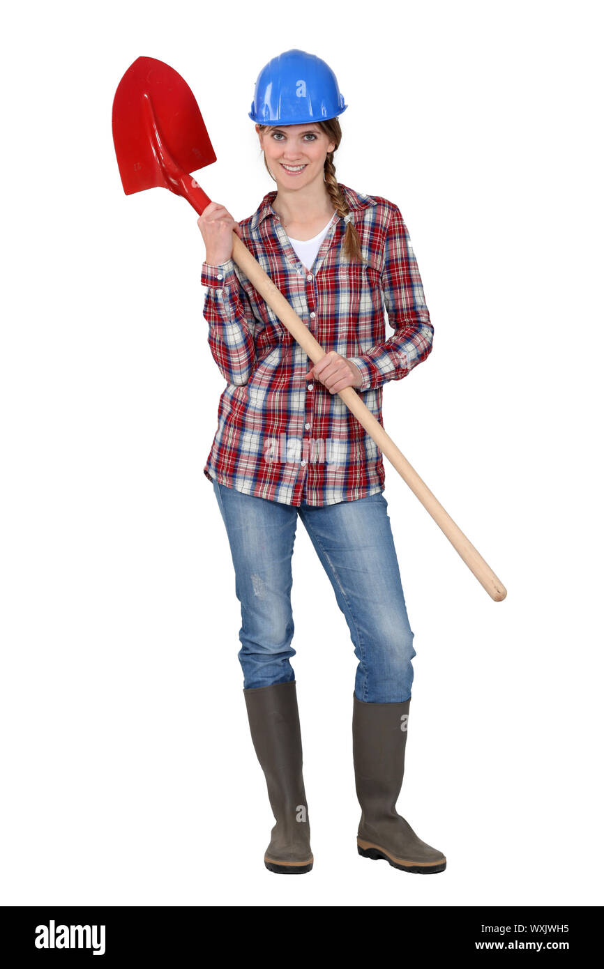 Woman with shovel Stock Photo - Alamy