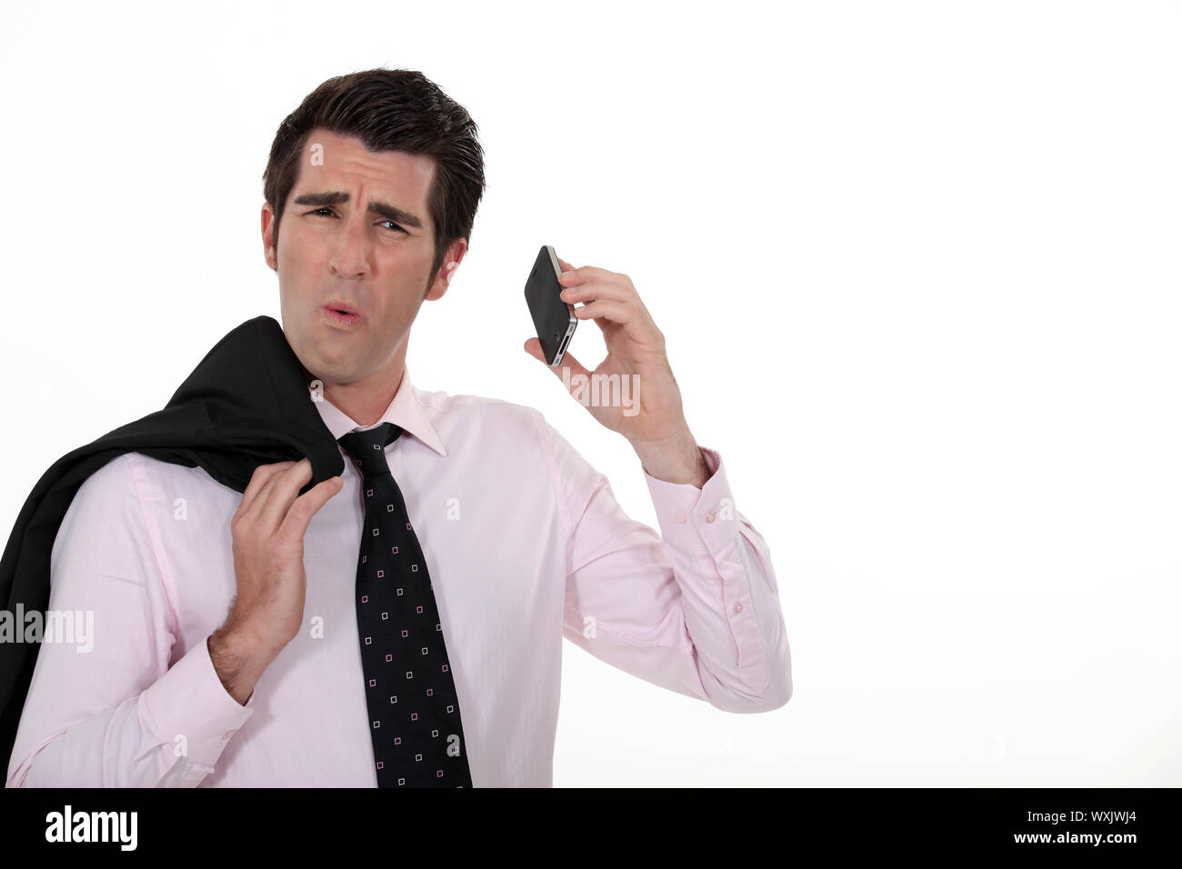 Businessman taking a bad phone call Stock Photo - Alamy