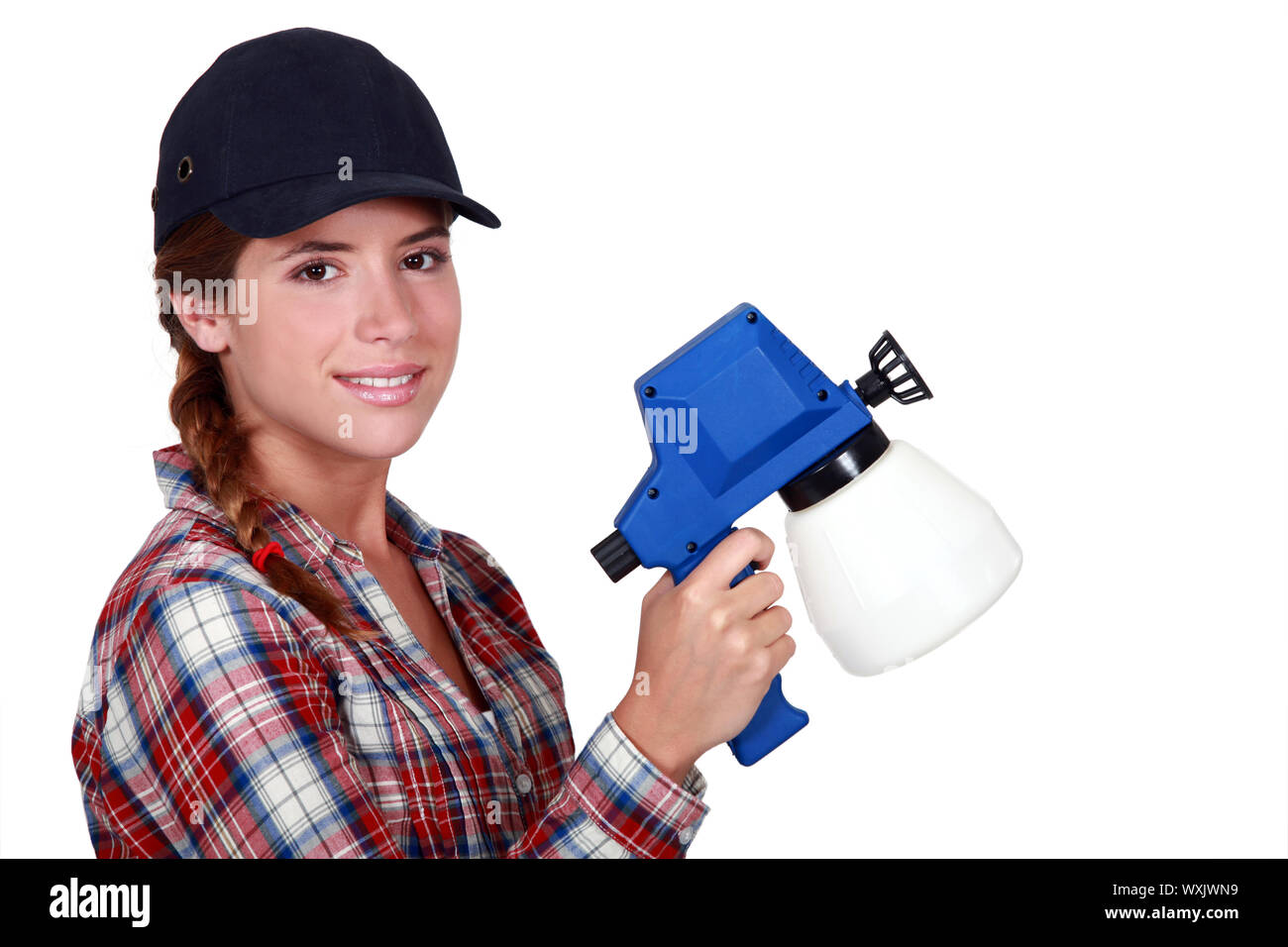 Woman holding spray for painting Stock Photo - Alamy