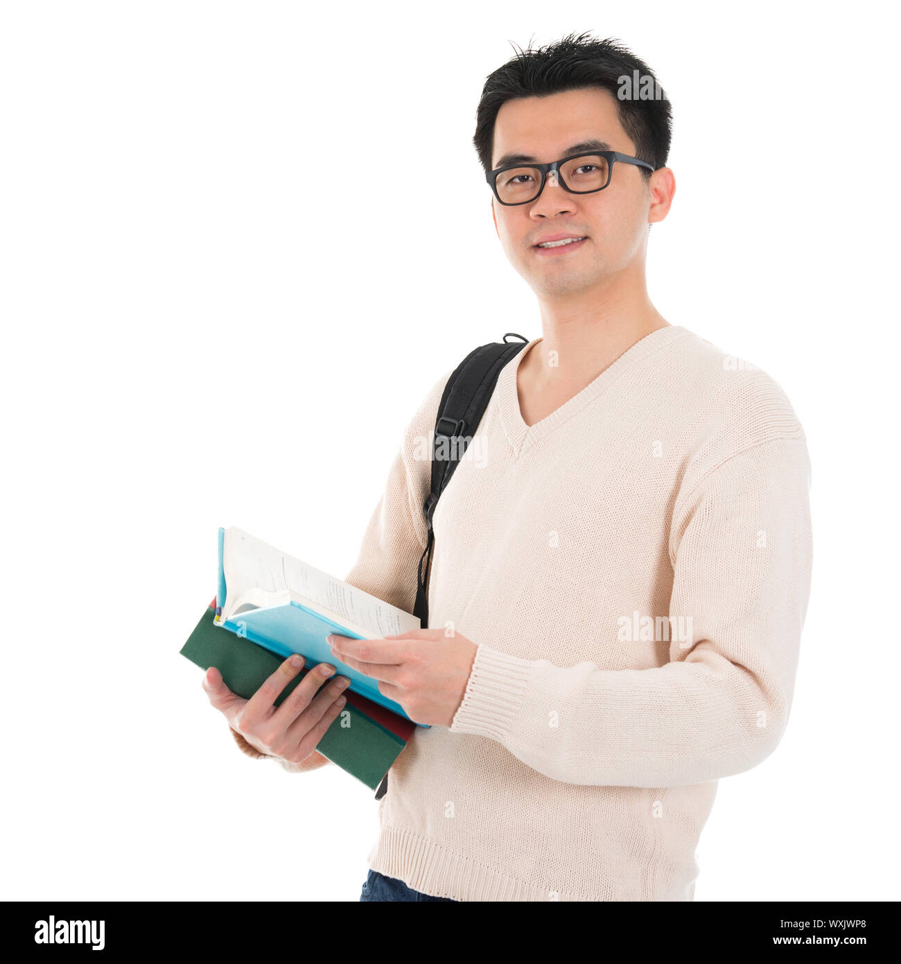 Asian adult male student in casual wear with school bag carrying text ...