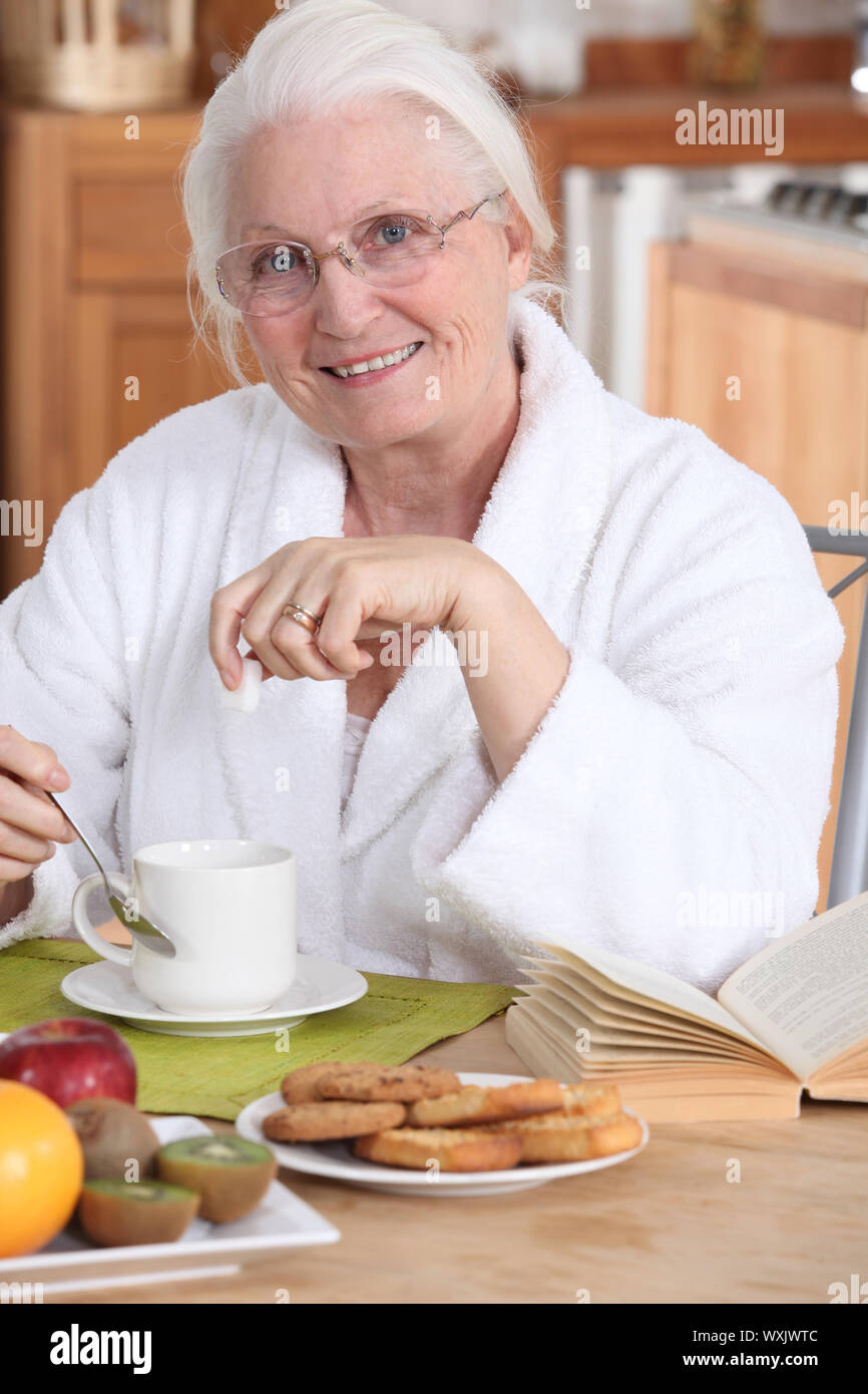 Old lady eating breakfast Stock Photo - Alamy