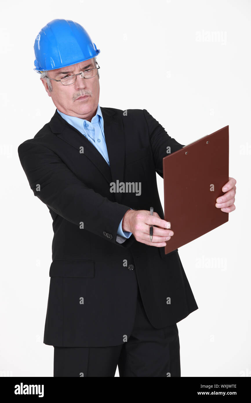 businessman looking critically at a report Stock Photo - Alamy