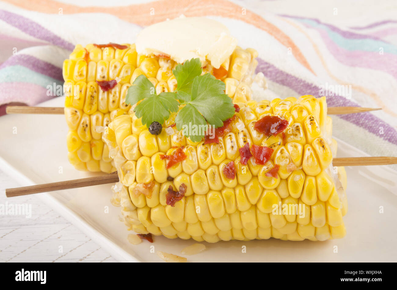 grilled corn on the cob on a wooden skewer Stock Photo - Alamy
