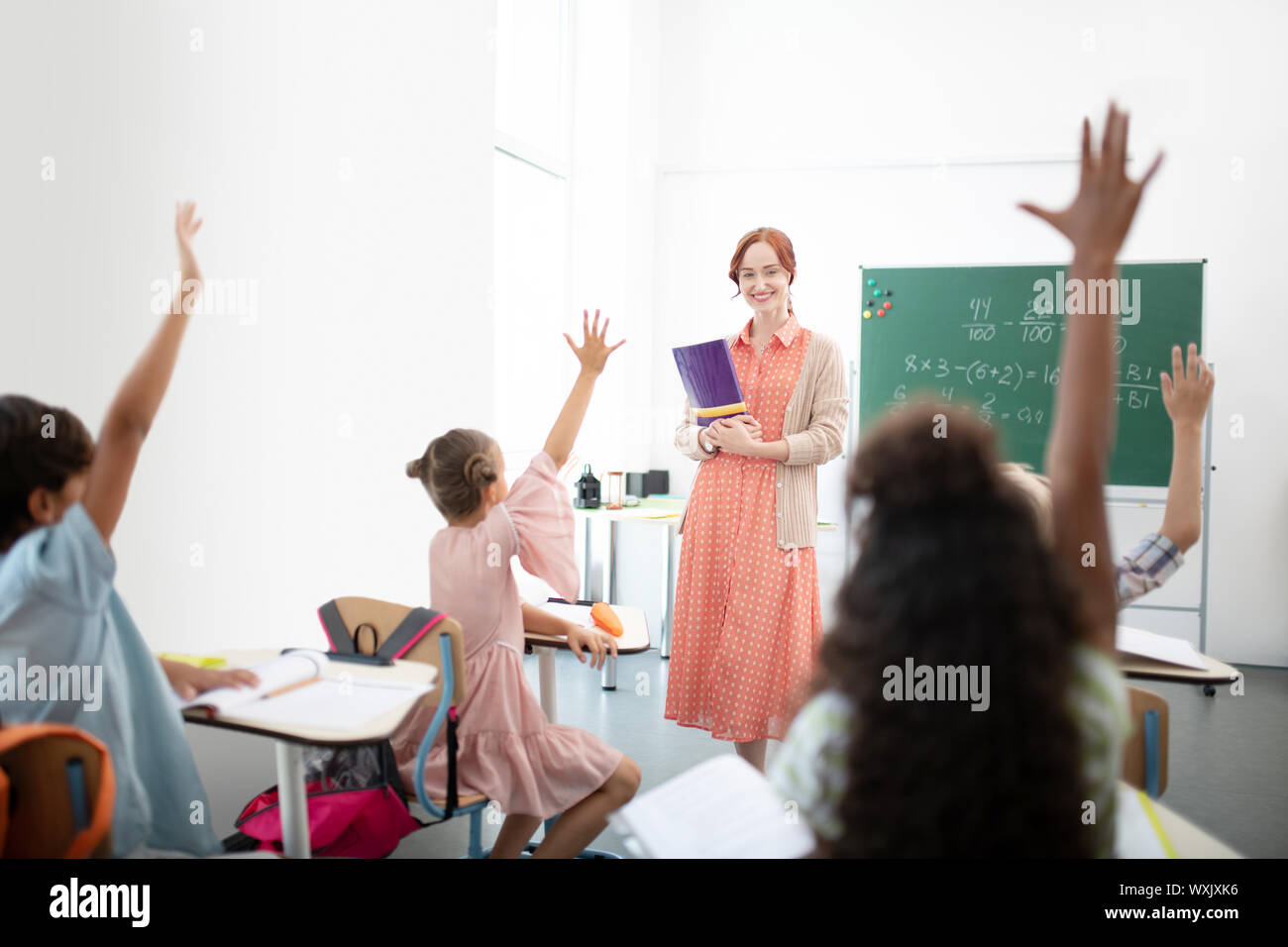 Teacher feeling happy while all the children having the answer Stock ...
