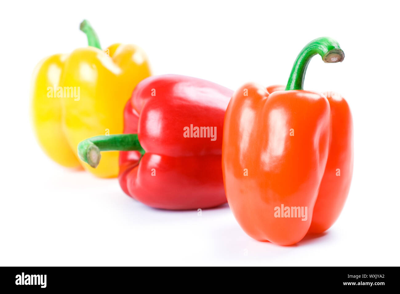 three bell peppers isolated on white background Stock Photo - Alamy