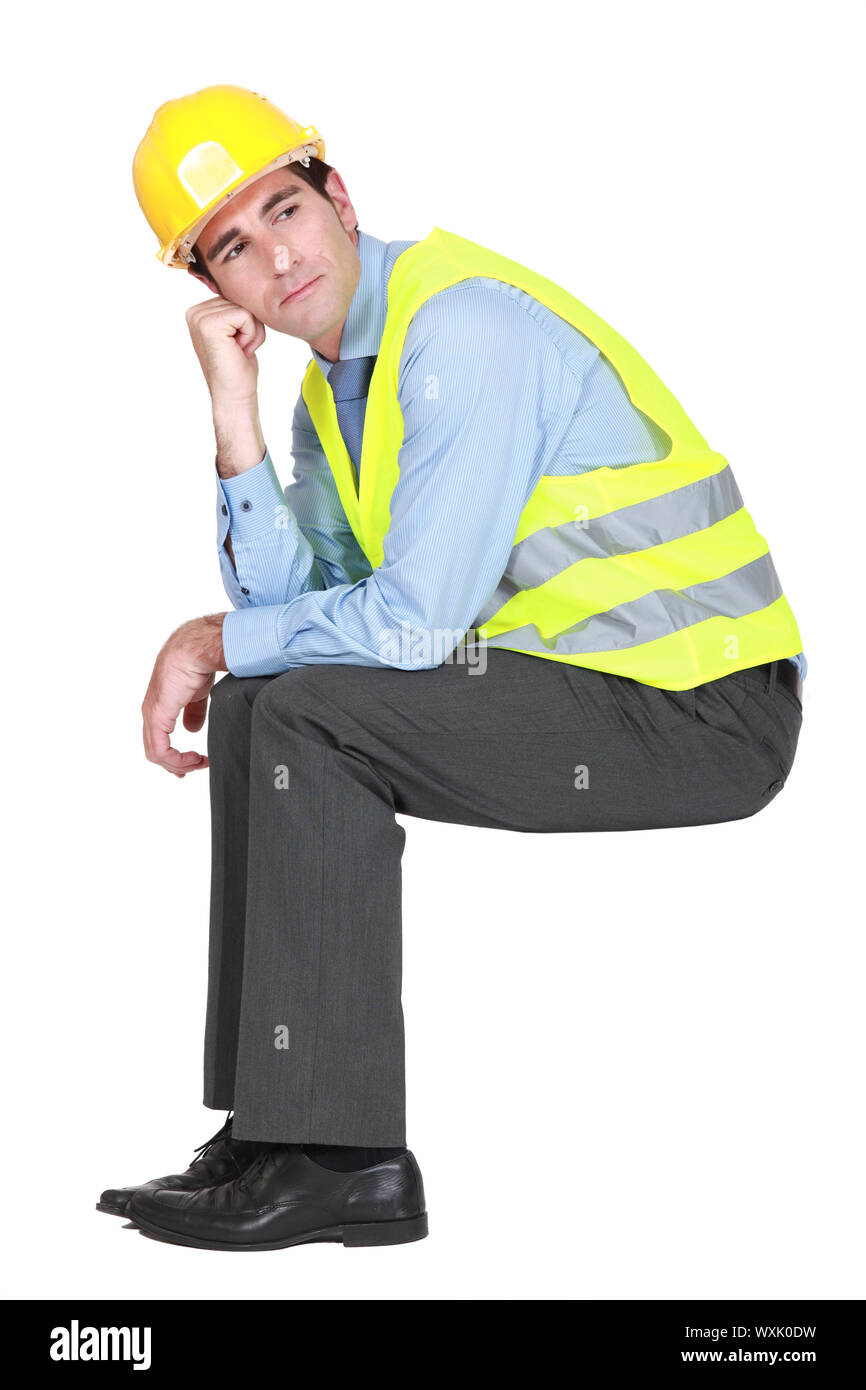 Architect thinking whilst sat down Stock Photo - Alamy
