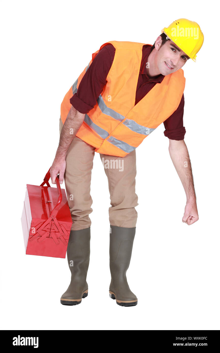 Construction worker lifting something heavy Stock Photo - Alamy