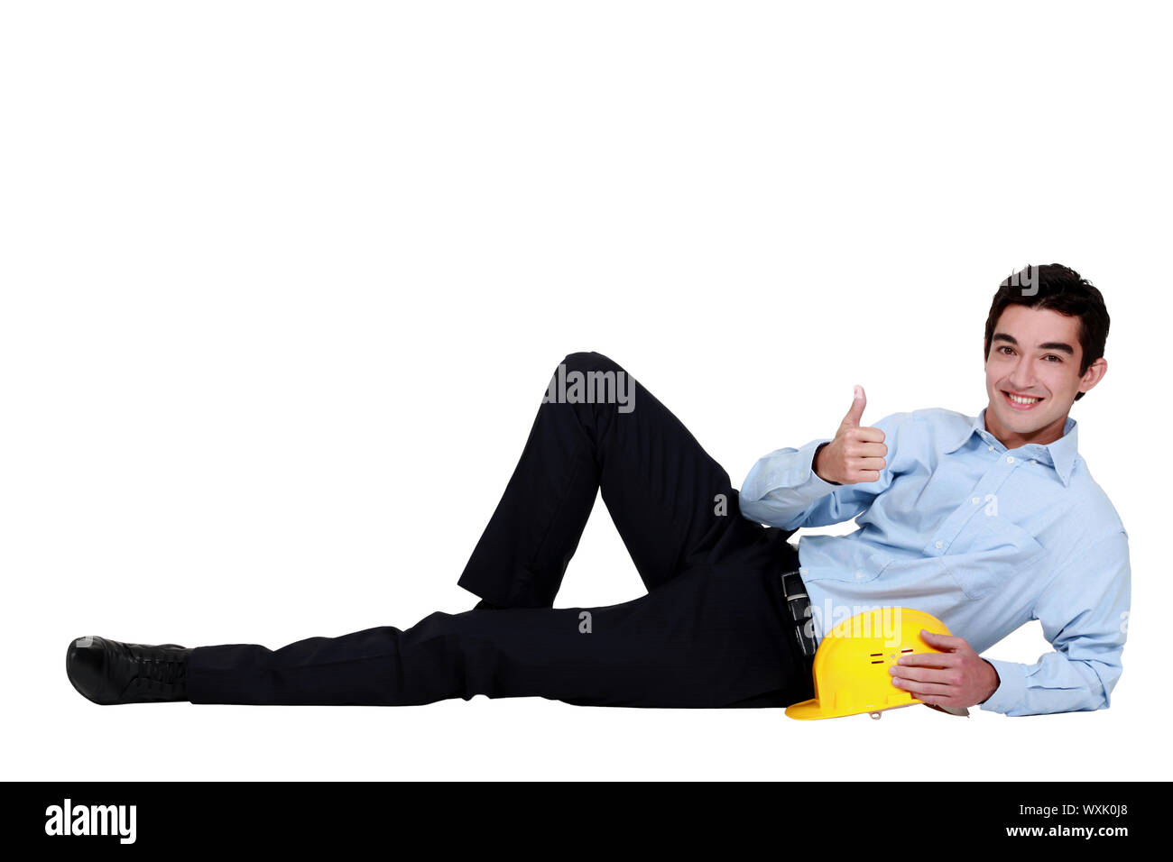 Young engineer giving the thumb's up Stock Photo - Alamy