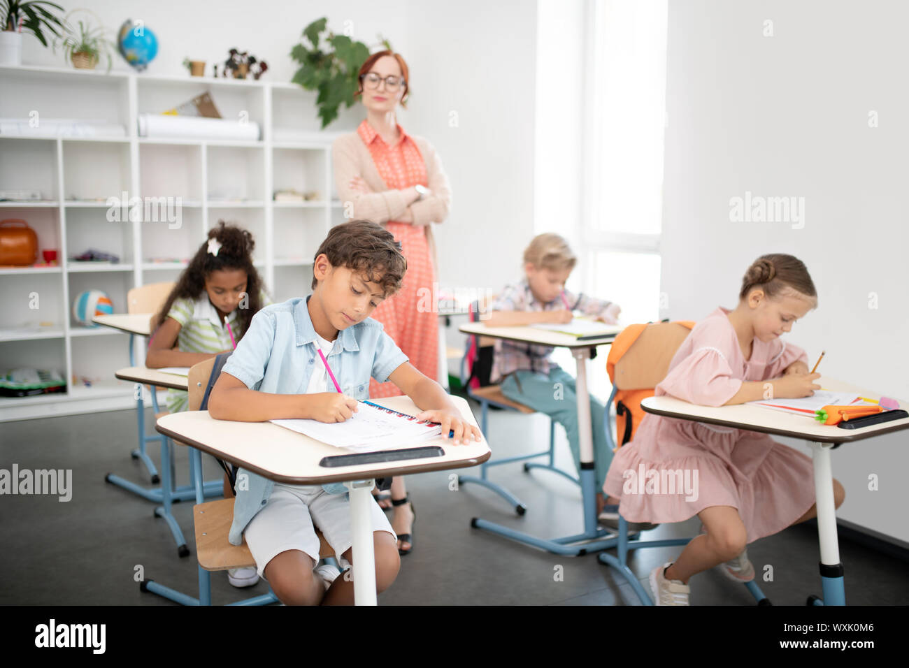Writing boy wearing red hi-res stock photography and images - Alamy