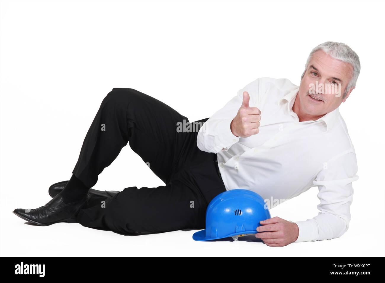 Man reclining on the floor Stock Photo - Alamy